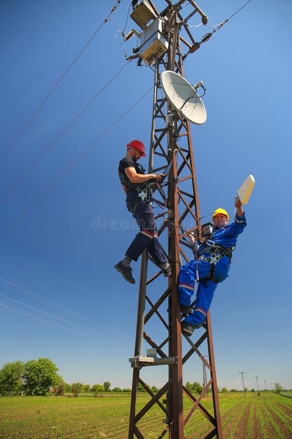 Two Workers with Masks Control Telecommunication Antenna System Stock ...