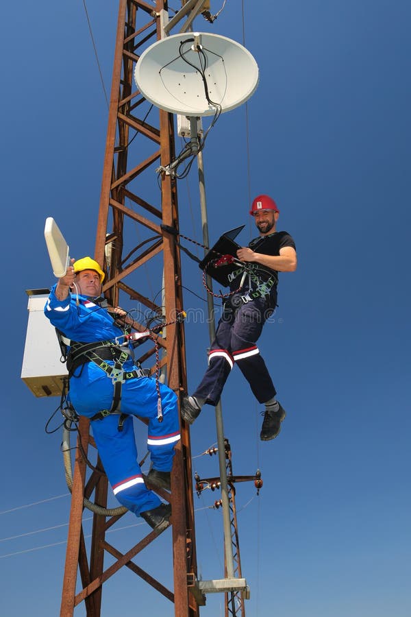 Two Workers with Masks Control Telecommunication Antenna System Stock ...