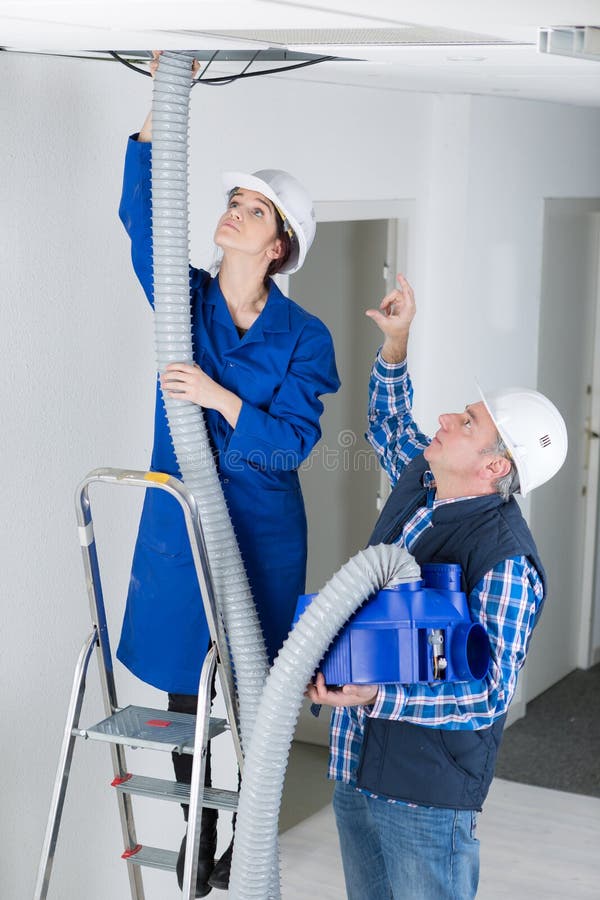 Two Electricians Working Together Stock Photo - Image of service ...