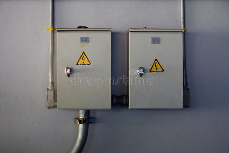 Two Electricity Cabinet with Warning Sign on the Wall. Stock Image ...