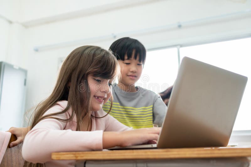Two Elementary School Kids Using Laptop Stock Image - Image of ...
