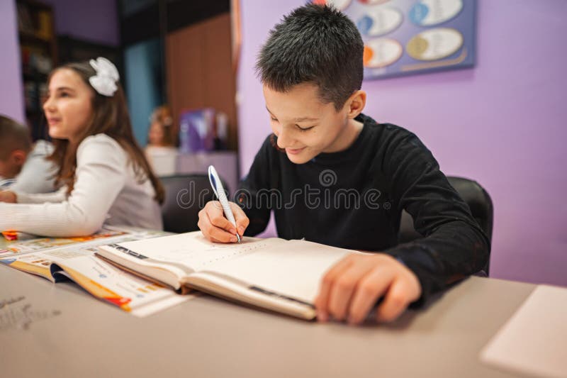 Two Elementary Students Learning Together at Language School Stock ...