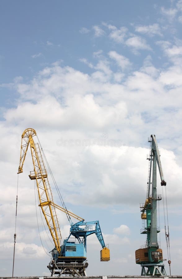 Two elevating cranes stock photo. Image of blue, yellow - 14425610
