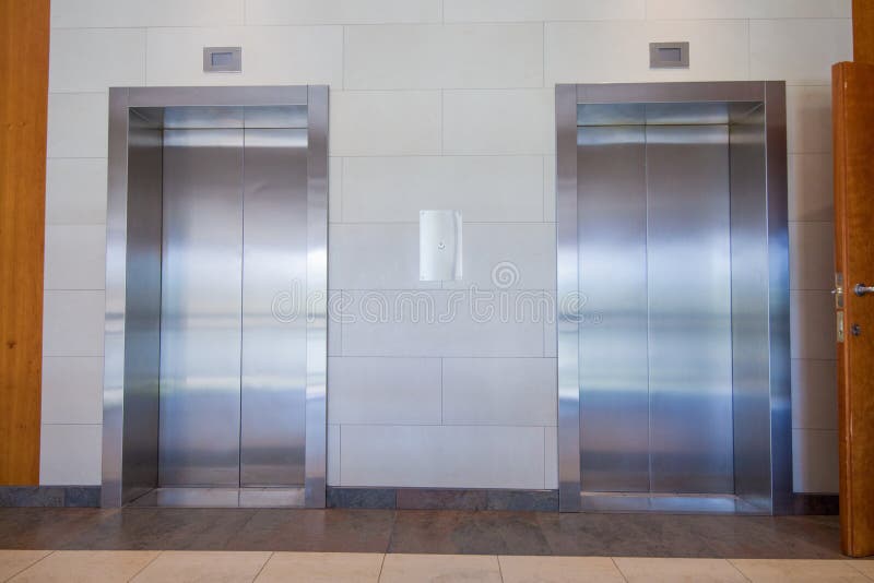 Two Elevators With Closed Metallic Doors Stock Photo - Image of ...