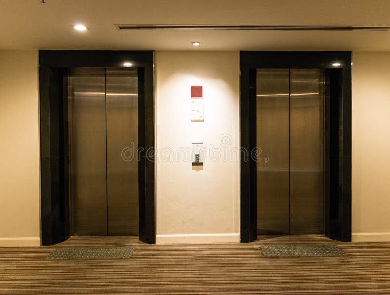 Two elevator doors stock photo. Image of indoors, metallic - 34413790