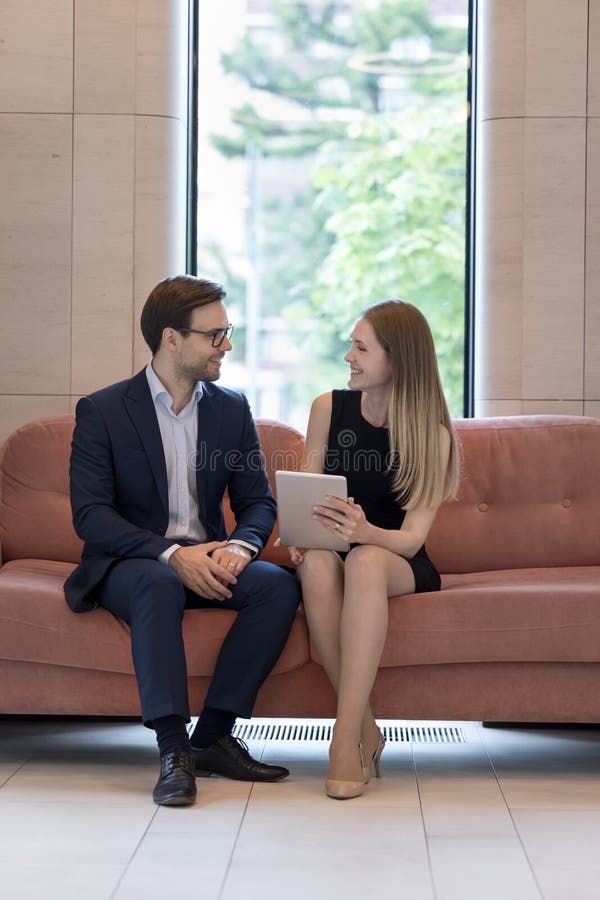 Two Employees Discussing on-line Presentation on Tablet Computer Stock ...