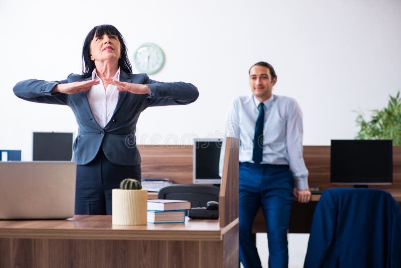 Two Employees Doing Sport Exercises in the Office Stock Photo - Image ...