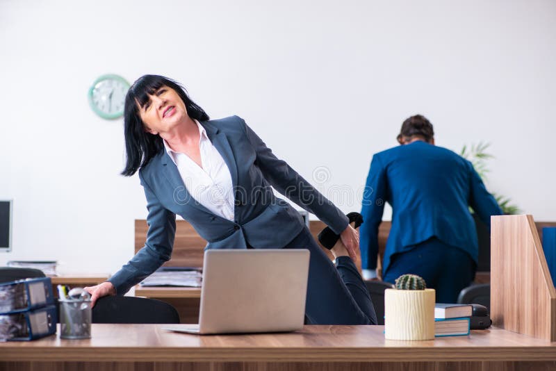 Two Employees Doing Sport Exercises in the Office Stock Photo - Image ...