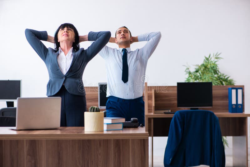 Two Employees Doing Sport Exercises in the Office Stock Photo - Image ...