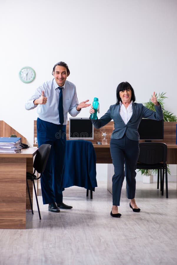 Two Employees Doing Sport Exercises in the Office Stock Photo - Image ...