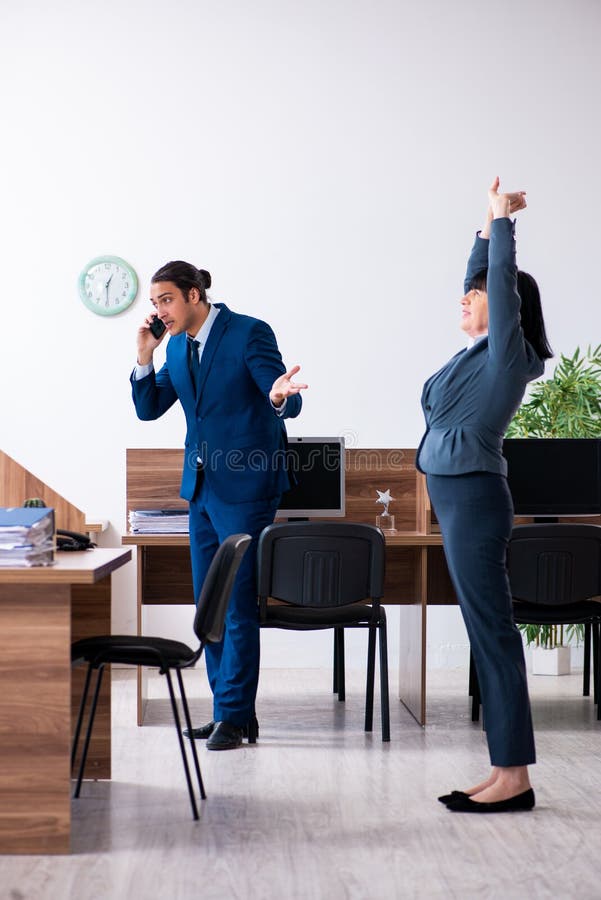 Two Employees Doing Sport Exercises in the Office Stock Photo - Image ...