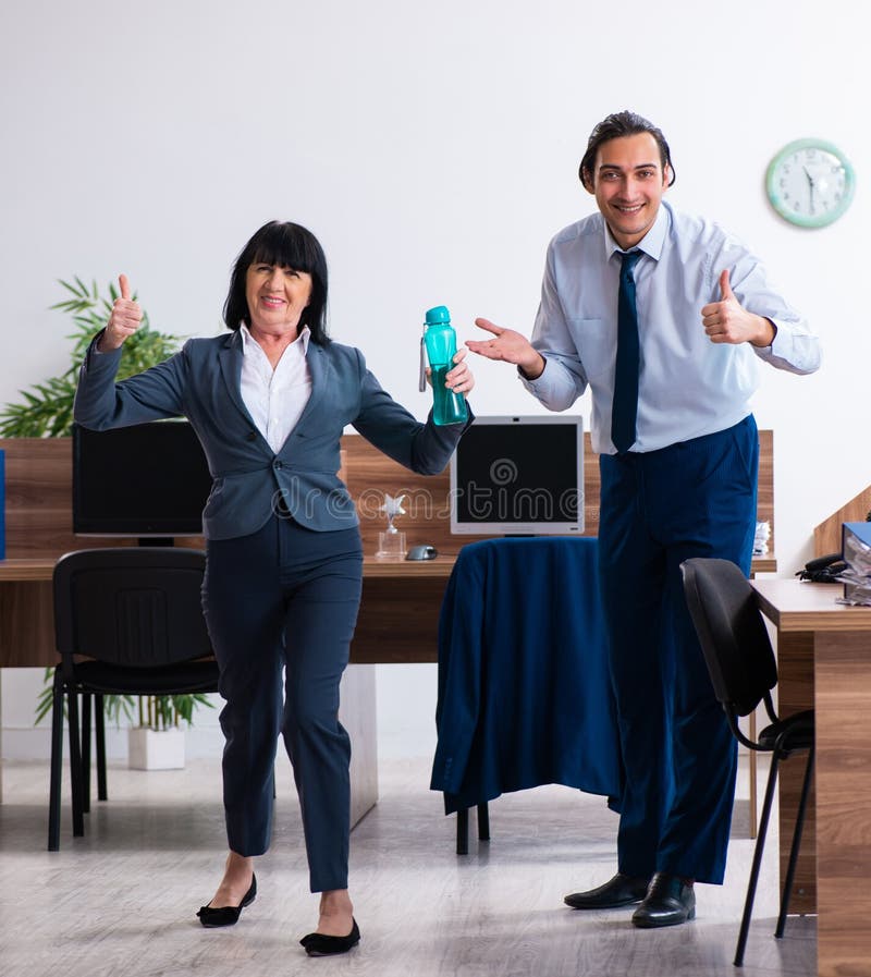 Two Employees Doing Sport Exercises in the Office Stock Image - Image ...