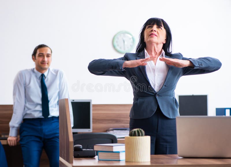 Two Employees Doing Sport Exercises in the Office Stock Photo - Image ...