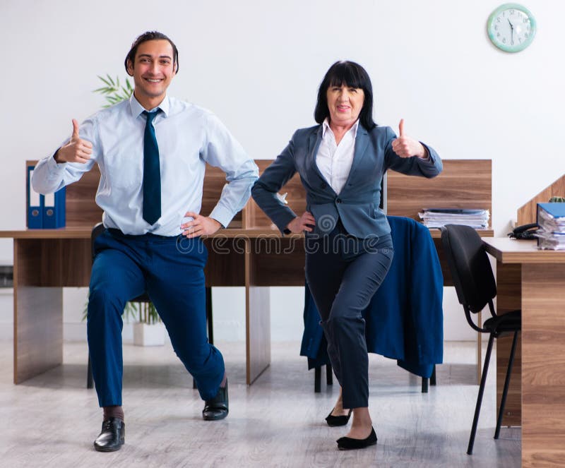 Two Employees Doing Sport Exercises in the Office Stock Image - Image ...