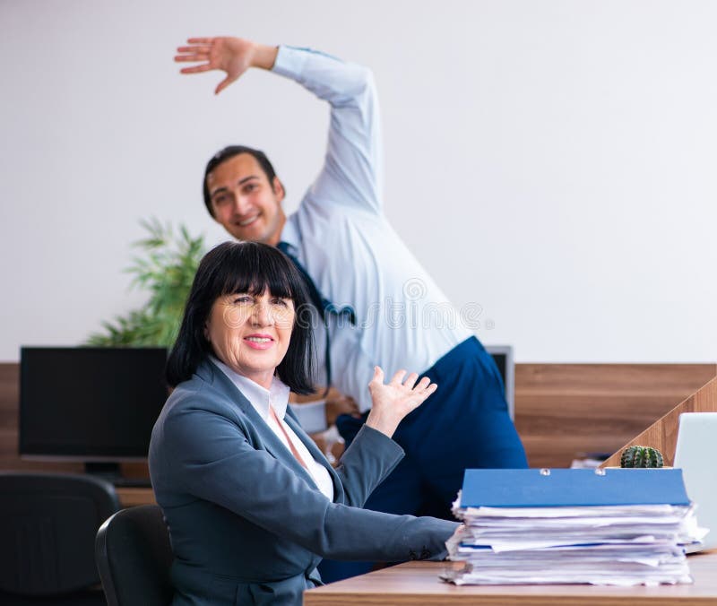 Two Employees Doing Sport Exercises in the Office Stock Image - Image ...