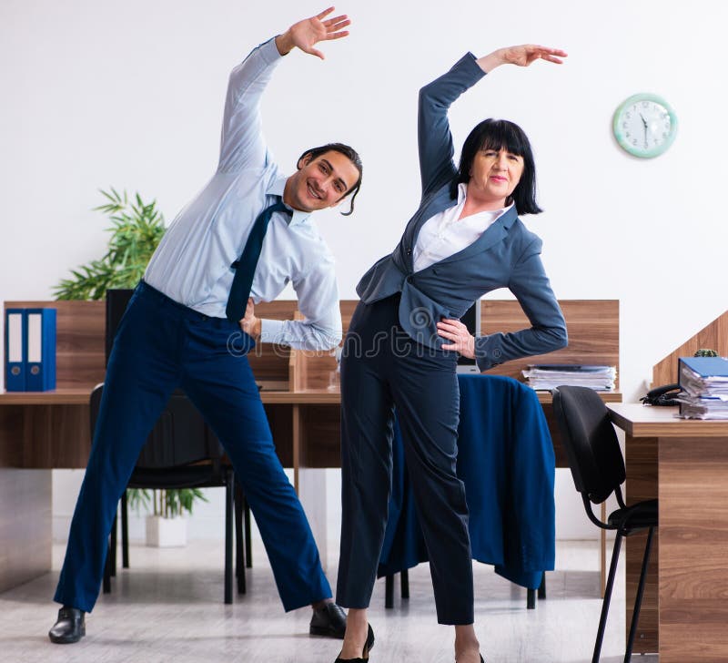 Two Employees Doing Sport Exercises in the Office Stock Photo - Image ...