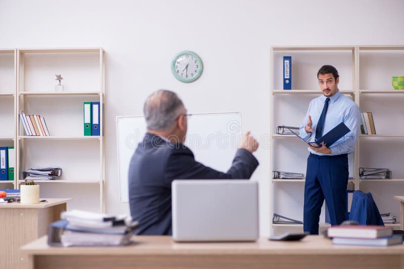 Two Employees in the Office Stock Image - Image of paperwork, office ...