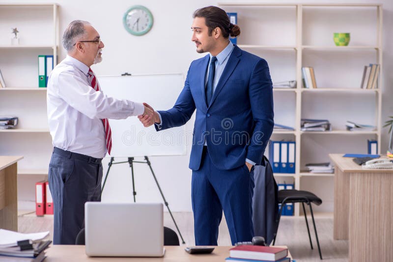 Two Employees in the Office Stock Photo - Image of hand, meeting: 196729886