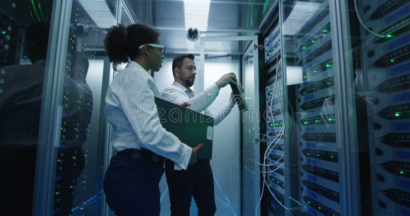Two Men Performing Maintenance in a Data Center Stock Video - Video of ...