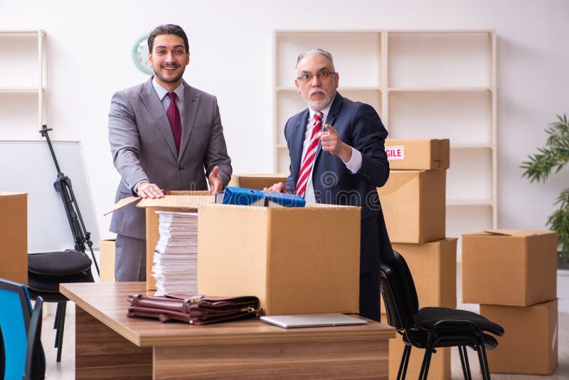 Two Male Employees in Relocation Concept Stock Photo - Image of ...
