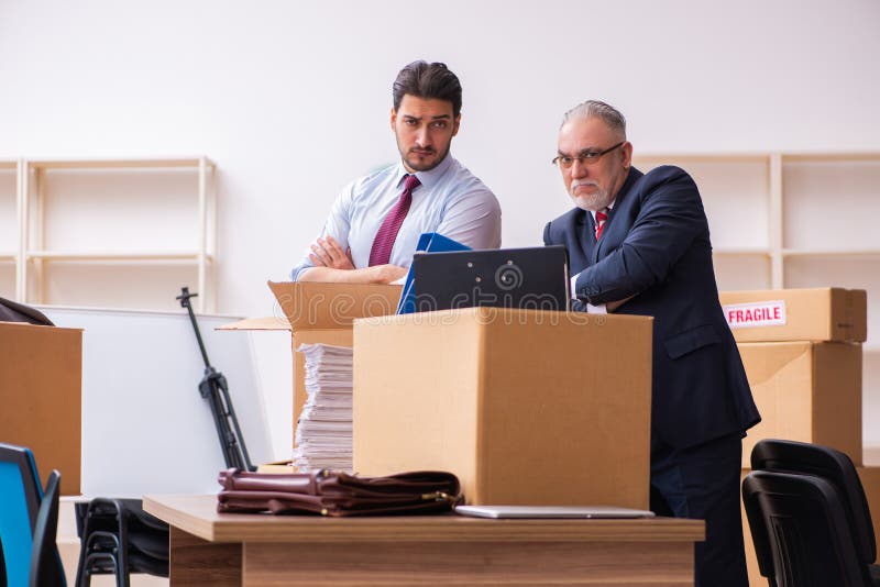 Two Male Employees in Relocation Concept Stock Photo - Image of ...