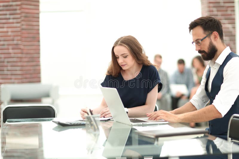 Two Employees Sitting at a Desk in the Office. Stock Photo - Image of ...