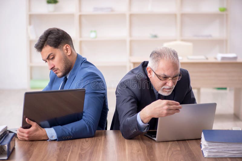 Two Male Employees Working in the Office Stock Photo - Image of ...