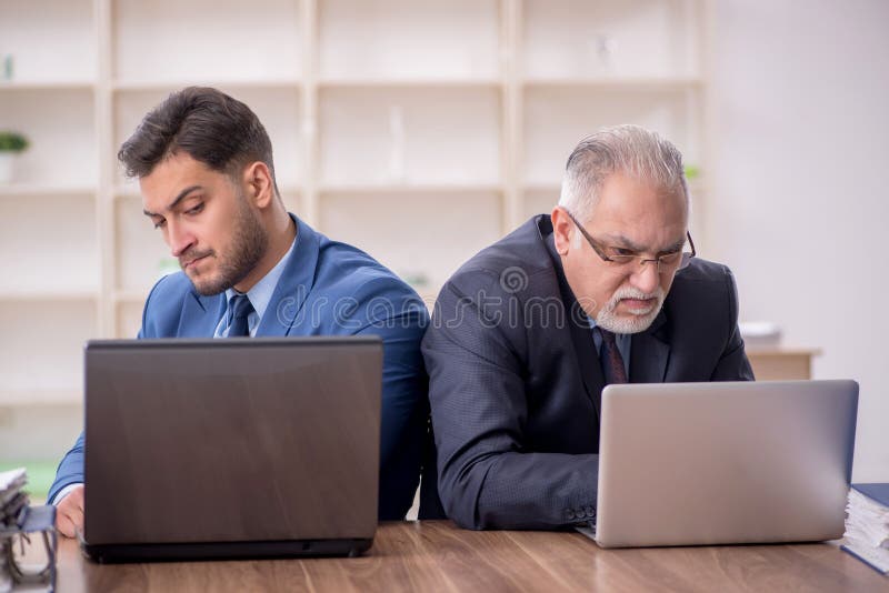 Two Male Employees Working in the Office Stock Photo - Image of ...