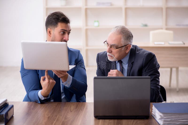 Two Male Employees Working in the Office Stock Image - Image of ...