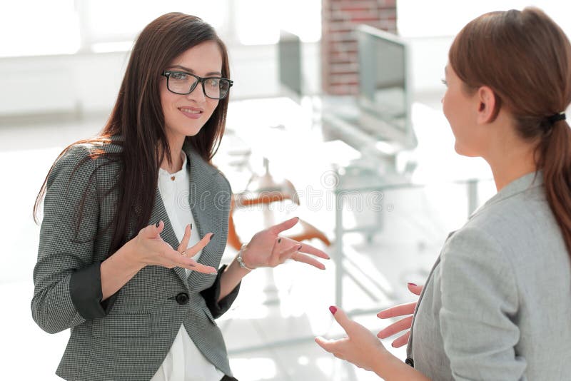 Two Employees Talking Standing in the Office Stock Image - Image of ...