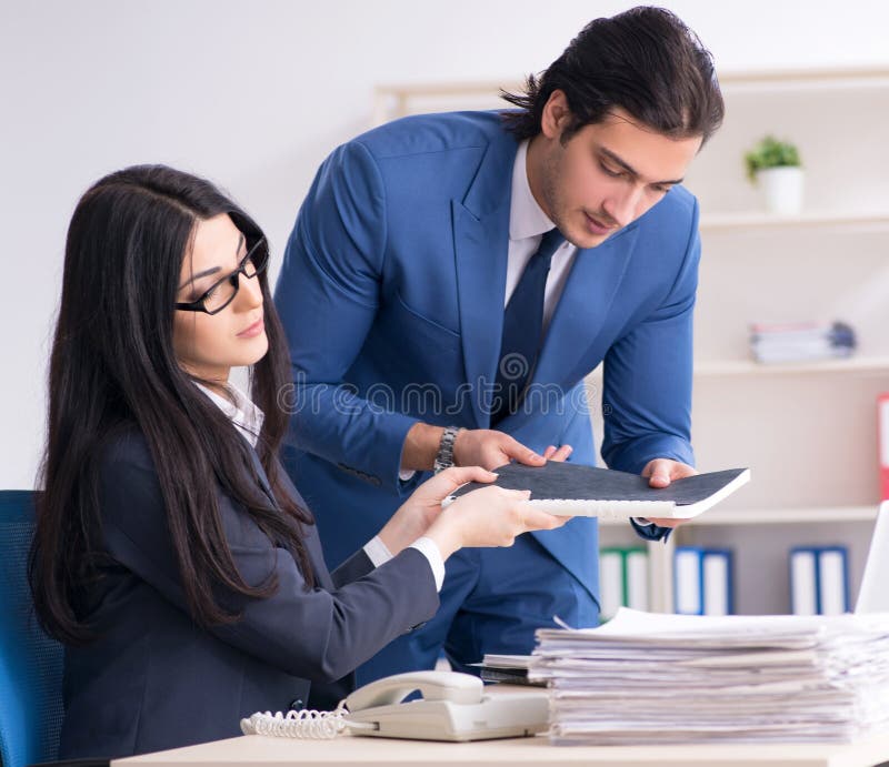 Two Employees Working in the Office Stock Image - Image of document ...