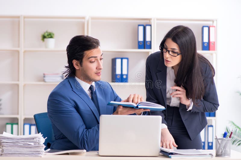 Two Employees Working in the Office Stock Image - Image of document ...