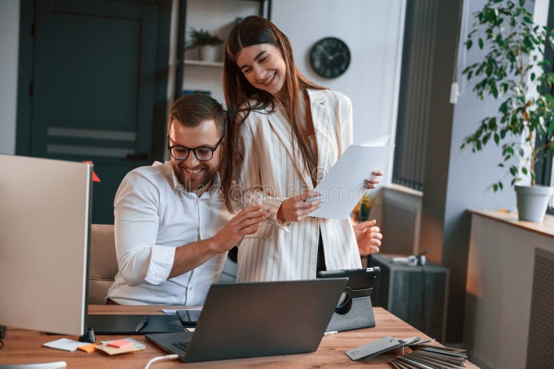 Two Employees are Working Together in the Modern Office Stock Photo ...