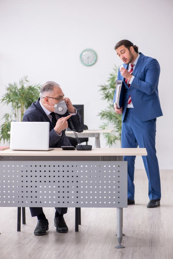 Two Employees at Workplace during Pandemic Stock Image - Image of ...