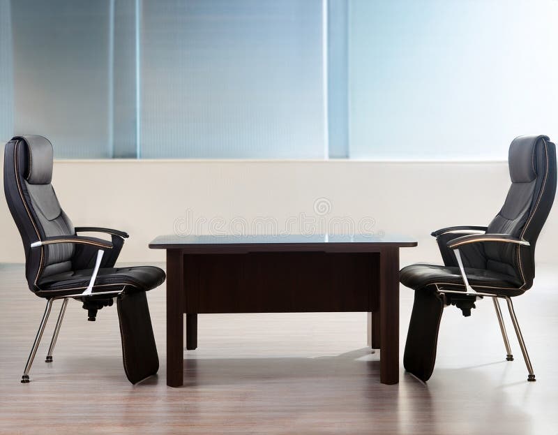 Two Empty Chairs Facing Each Other with a Negotiation Table in between ...