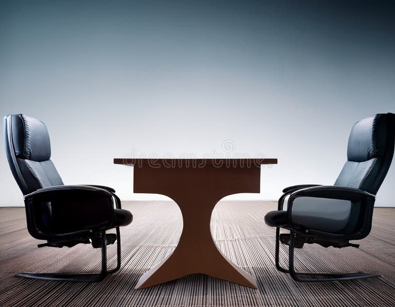 Two Empty Chairs Facing Each Other with a Negotiation Table in between ...