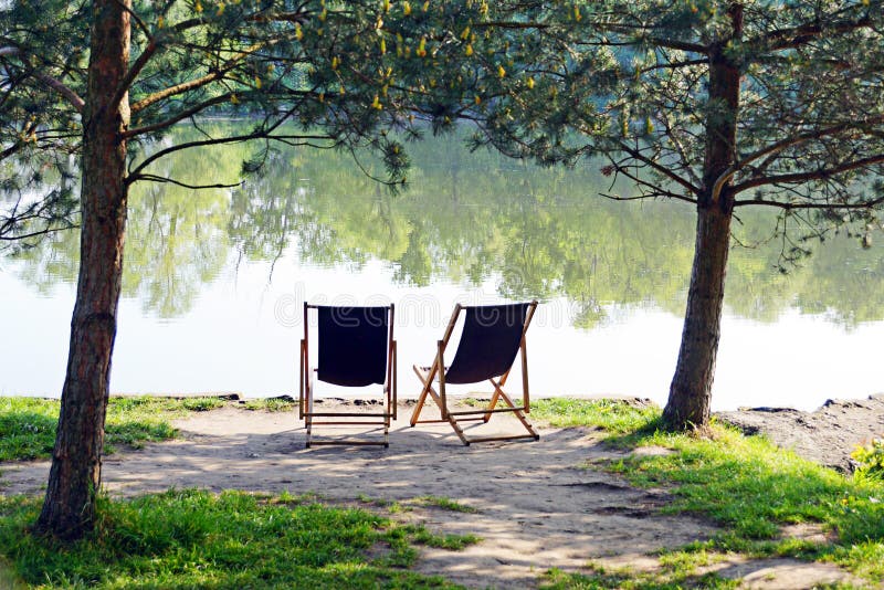 Two Empty Chairs Near River Stock Photo - Image of horizon, chair ...