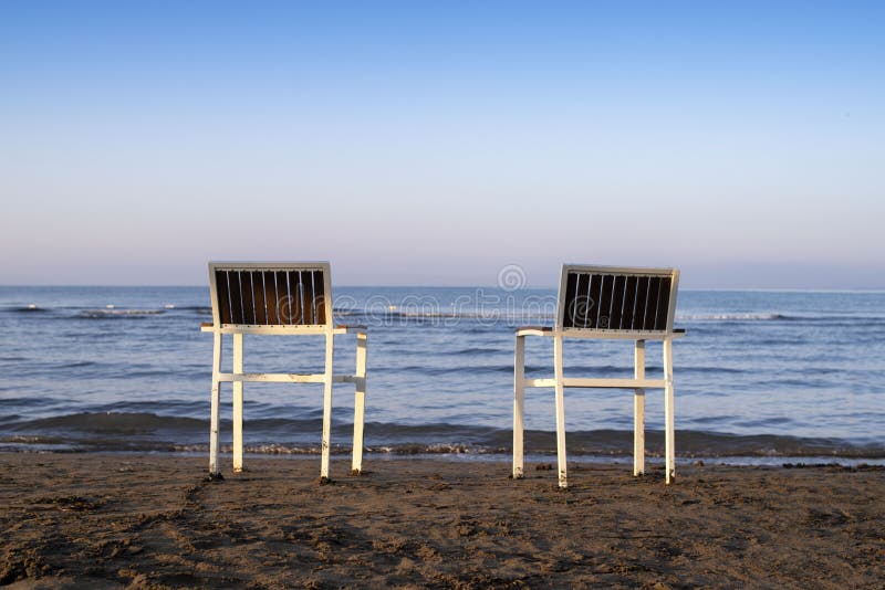 Two Empty Chairs Stand on Beach in Evening with View on Marine Sunset ...