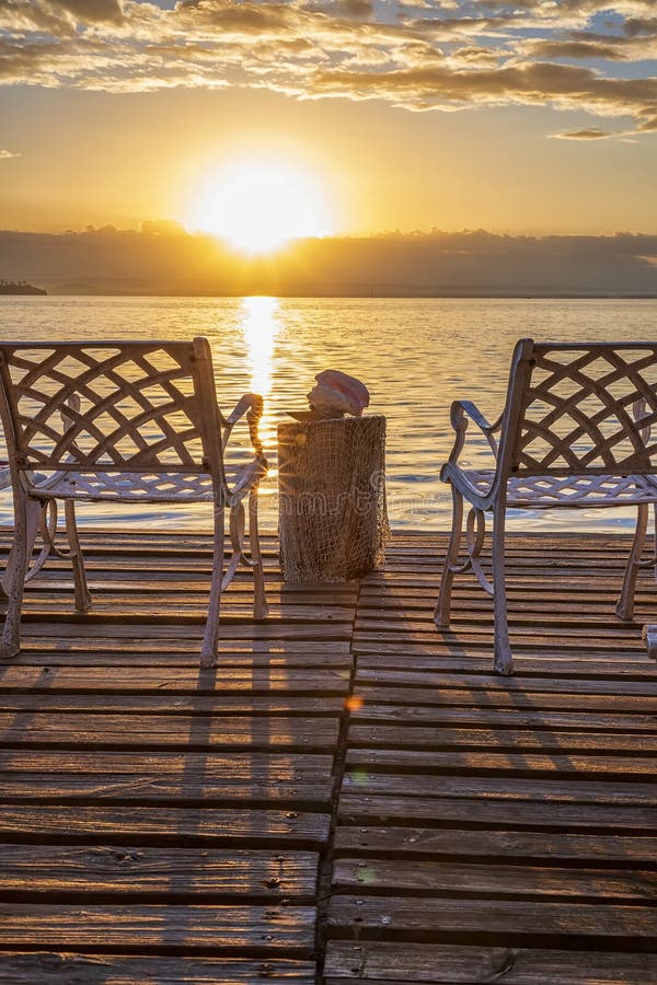 Two Empty Chairs at Sunrise on the Sea Beach. Stock Image - Image of ...