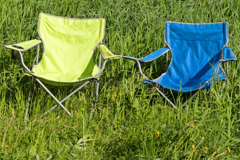Two Empty Folding Chair on the Green Grass Stock Image - Image of ...