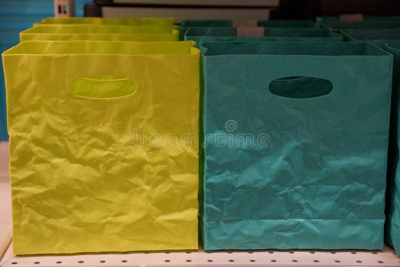 Two Plastic Bags of Yellow and Green Color on the Shelf Stock Image ...