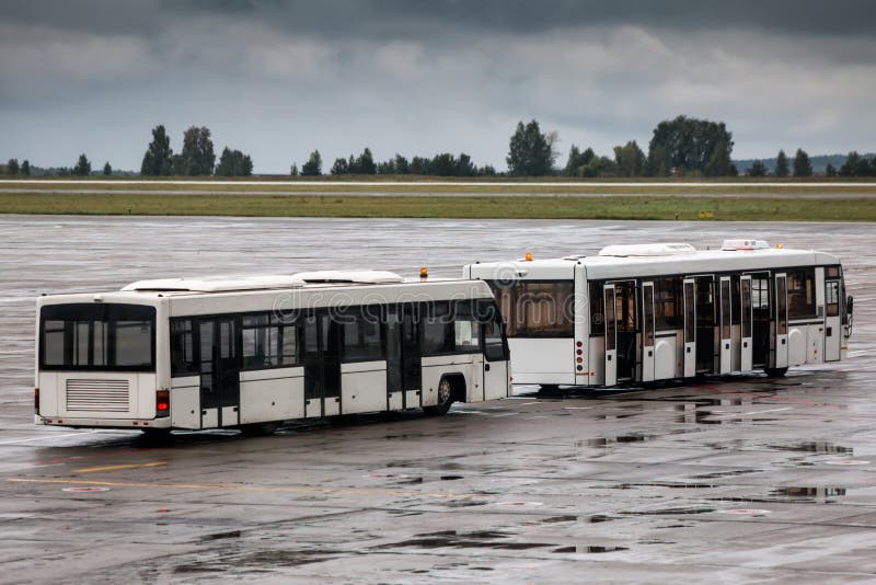 Shuttle Buses at the Parking Lot of the Airport Near the Jetway in the ...