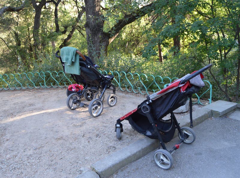 Two Empty Strollers are Standing in the Park Stock Photo - Image of ...