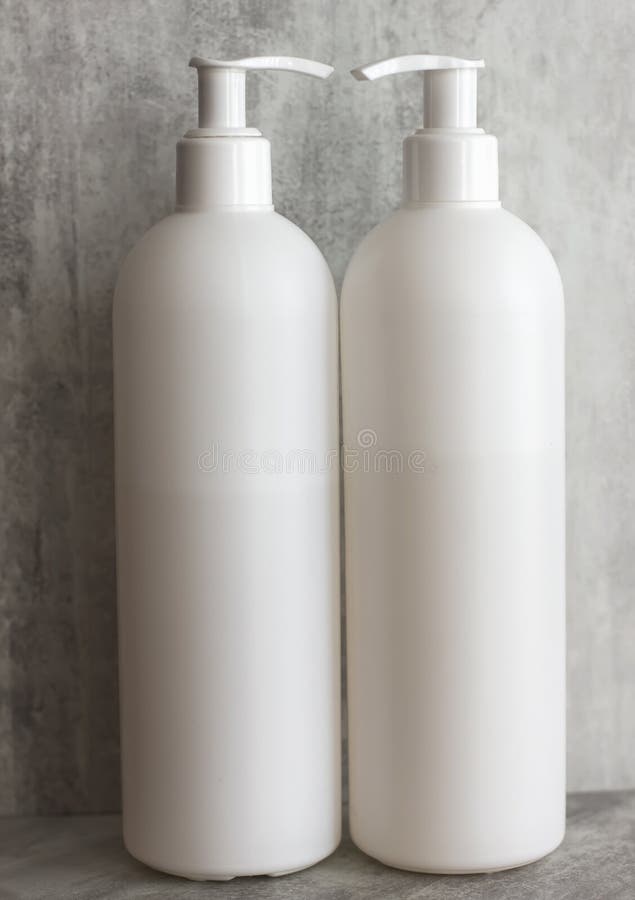 Two Empty White Plastic Containers with Dispenser on a Gray Background ...