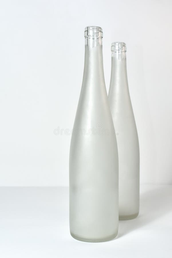 Two Empty Wine Bottles without Labels Standing on a Table Stock Image ...