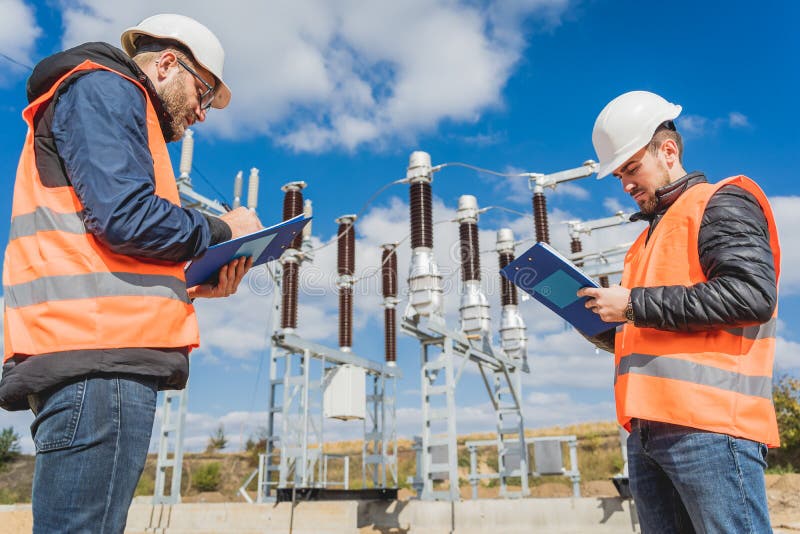 Two Engineer Electricians Check the Substation Construction Process ...