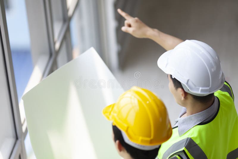 Two Engineer Looking Out the Window while Discussing Over New Coming ...