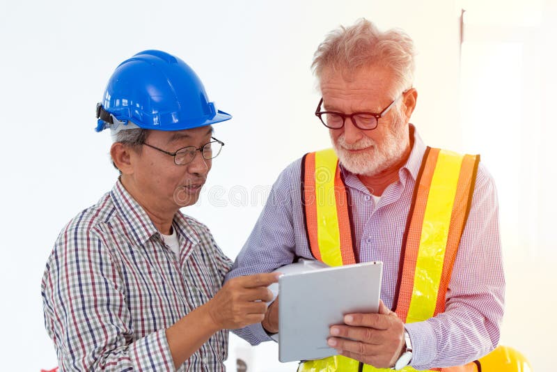 Two Engineer Mix Race Looking at Tablet Screen Using Technology Stock ...
