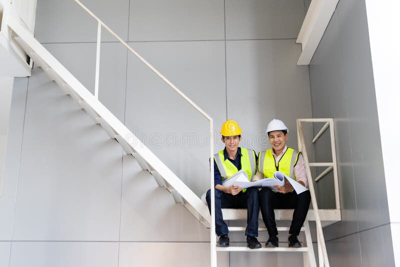 Two engineer reading plan stock photo. Image of hardhat - 177546474