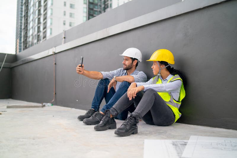 Two Engineer or Technician Workers Use Mobile Phone To Selfie after ...